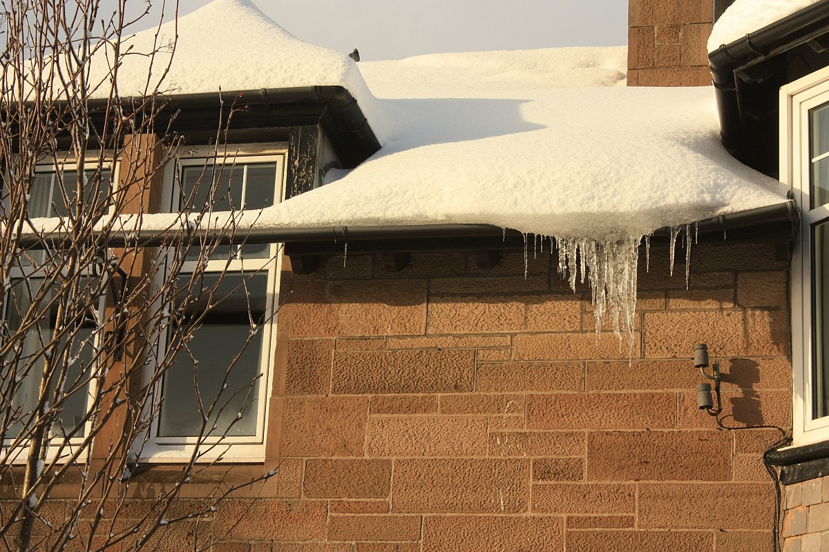 How to Safely Clear Snow Off a Roof | Networx